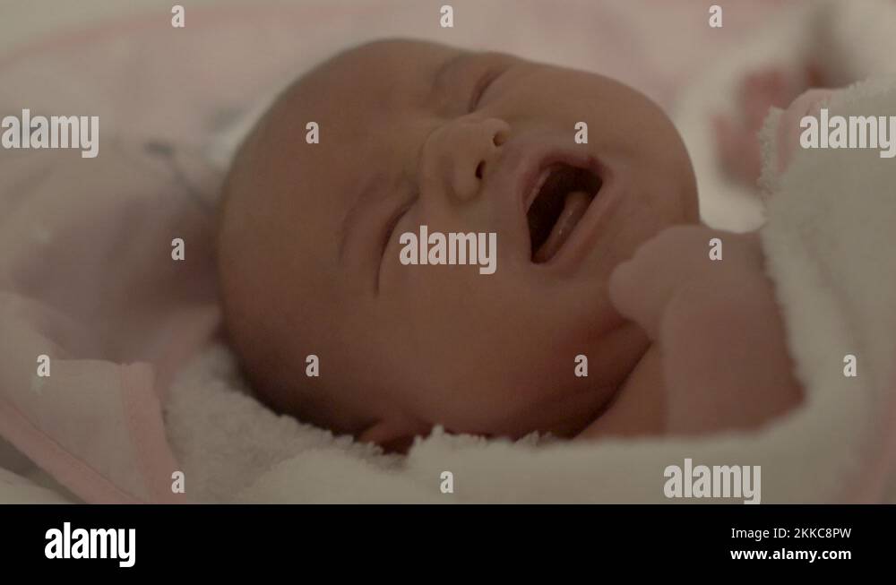 Newborn Baby Girl Crying As She is Patted Dry After Bathing- close up ...