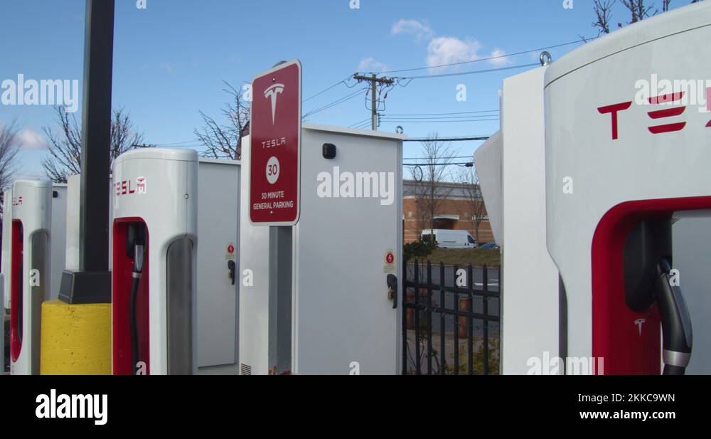 Tesla Electric Car, Supercharger Charging Station. Tesla Logo Stock ...