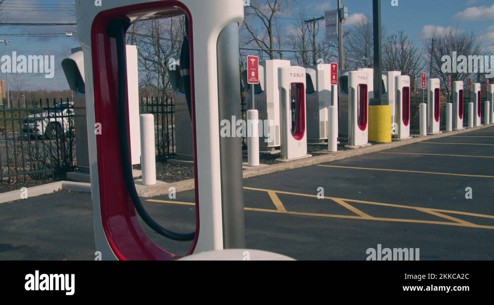 Tesla Electric Car, Supercharger Charging Station. Safety barrier Stock ...