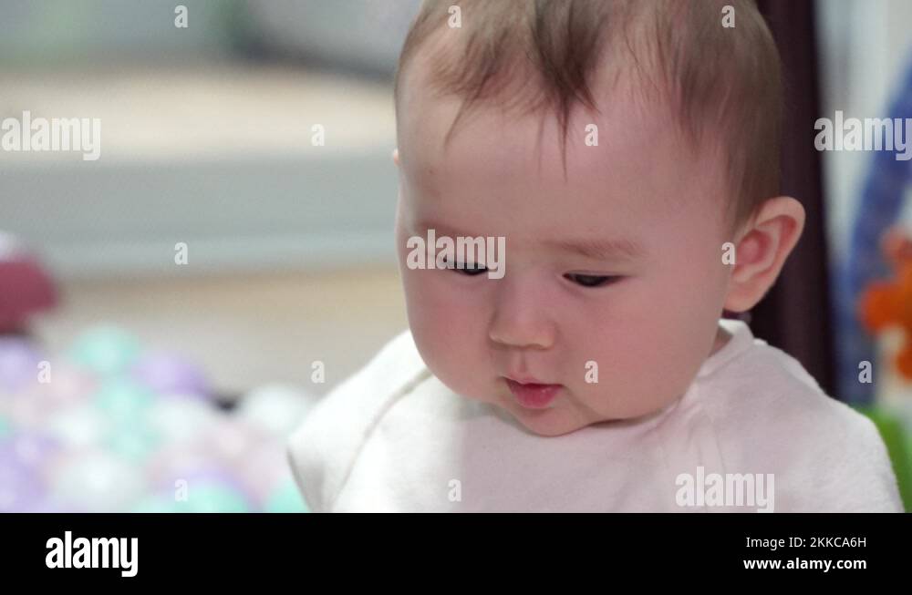 Happy Baby Girl With Chubby Cheeks Playing Inside Her Playpen ...