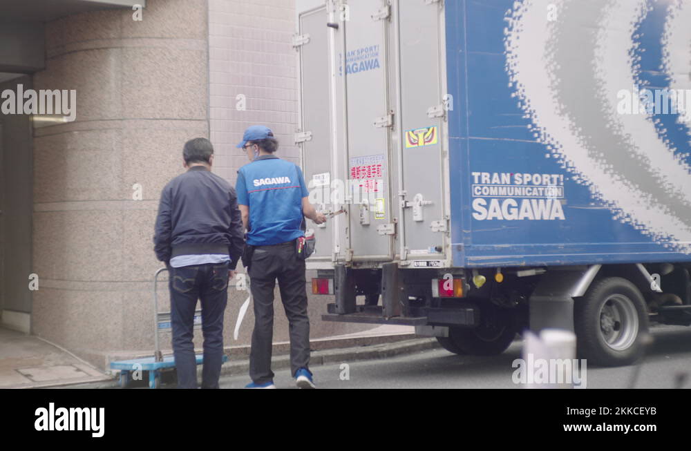 Delivery Man Closed The Door Of Sagawa Express Delivery Truck While ...