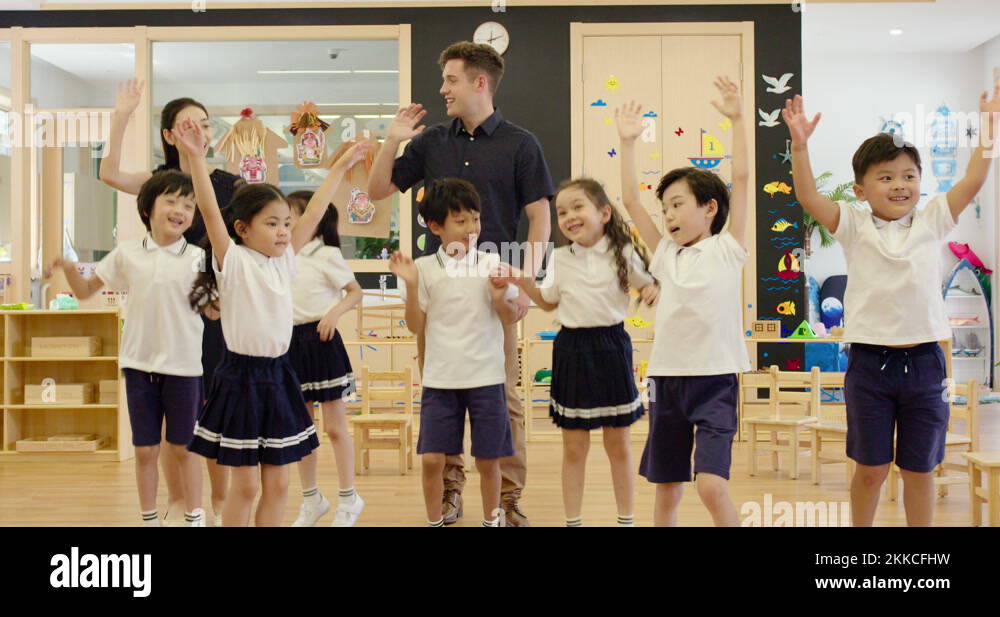 Teachers and children in kindergarten classroom,4K Stock Video Footage ...