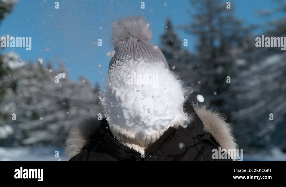 PORTRAIT: Smiling female tourist gets hit in the face by a fluffy ...