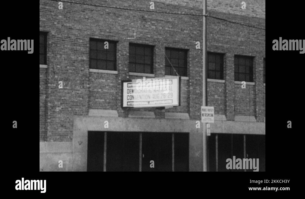 1960s Chicago: City. Sculpture. Men sit on park bench. Police officers ...