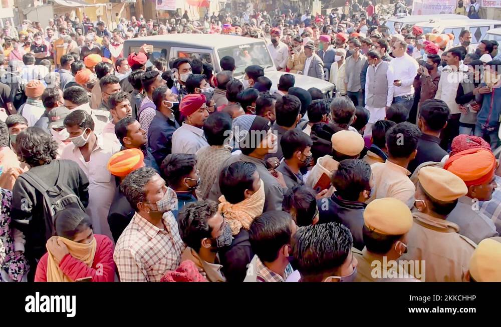 cars passes through the crowd of people, crowd of people letting cars ...