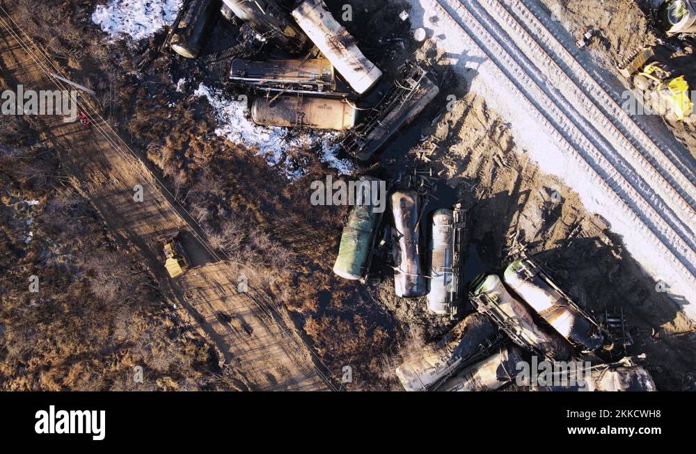 A train wreck on the railroad, scattered tanks, the bulldozer goes back ...