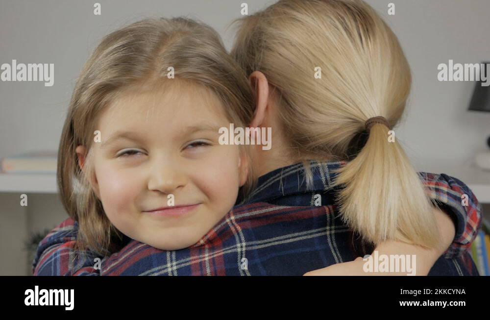 Happy cute little baby girl hugs parent mother, enjoy the tender sweet ...