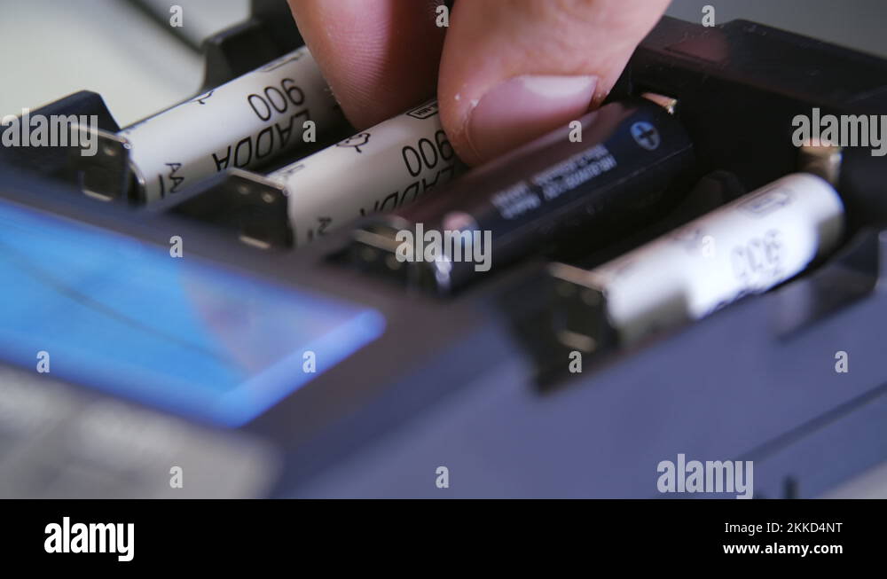 Removing the battery pack from the charger Stock Video Footage - Alamy