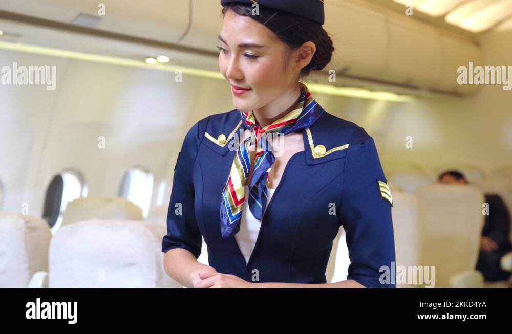 Cabin crew or air hostess working in airplane Stock Video Footage - Alamy