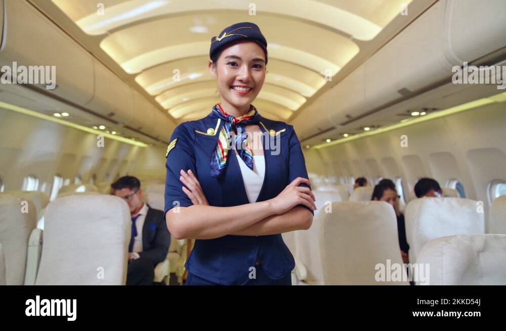 Cabin crew or air hostess working in airplane Stock Video Footage - Alamy
