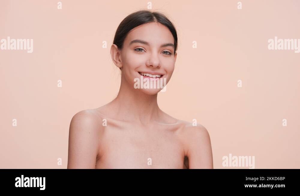 Young woman turn her face, look at the camera and smile Stock Video ...