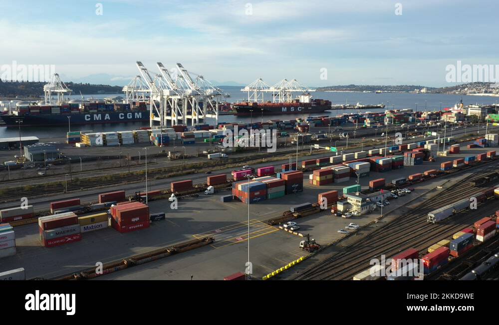 Cinematic drone footage of cargo ships getting unloaded by container ...
