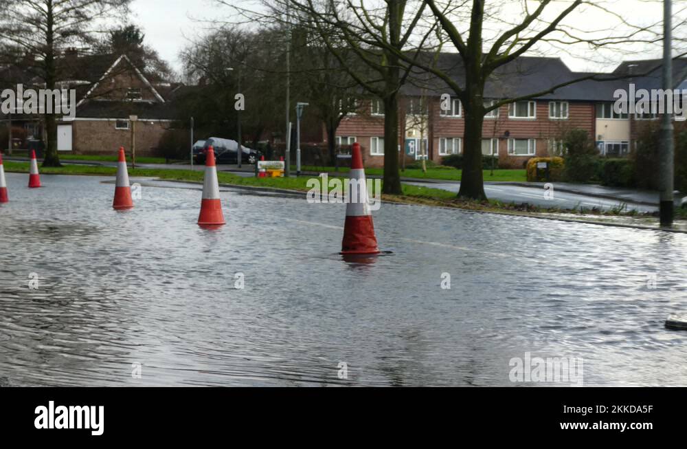 Storm Christoph car driving slow rainy flooding village road splashing ...