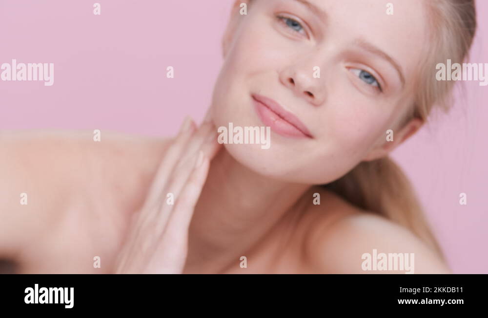Young woman raise her head from the arms and looks at the camera Stock ...