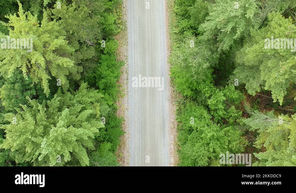 Drone reveal shot of top down(birds eye view) angle of an ATV or four ...