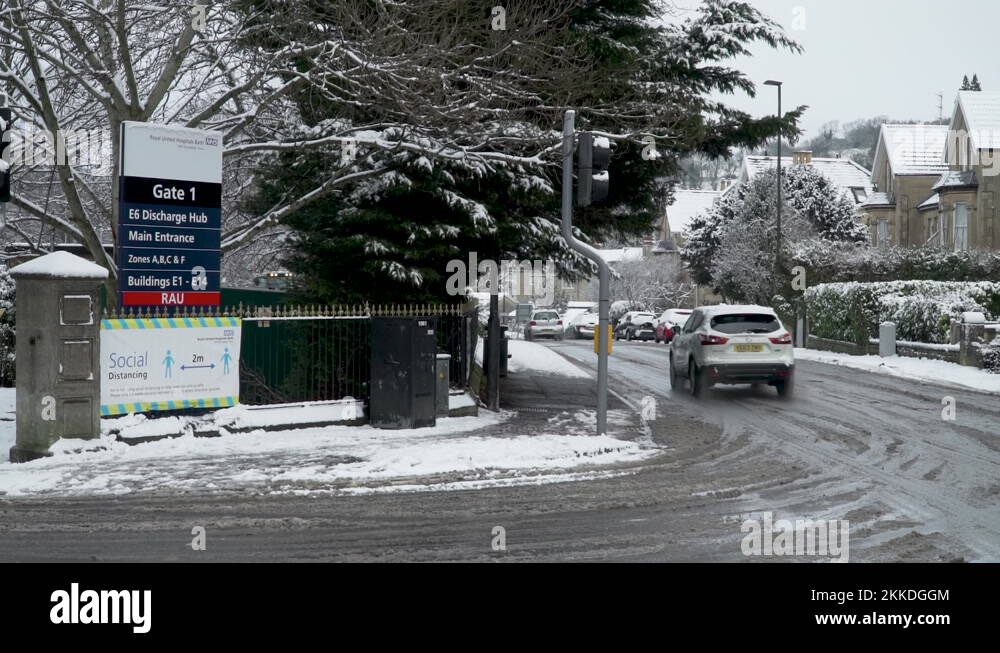 RUH hospital entrance in winter, snow on road, City of Bath, wide shot ...