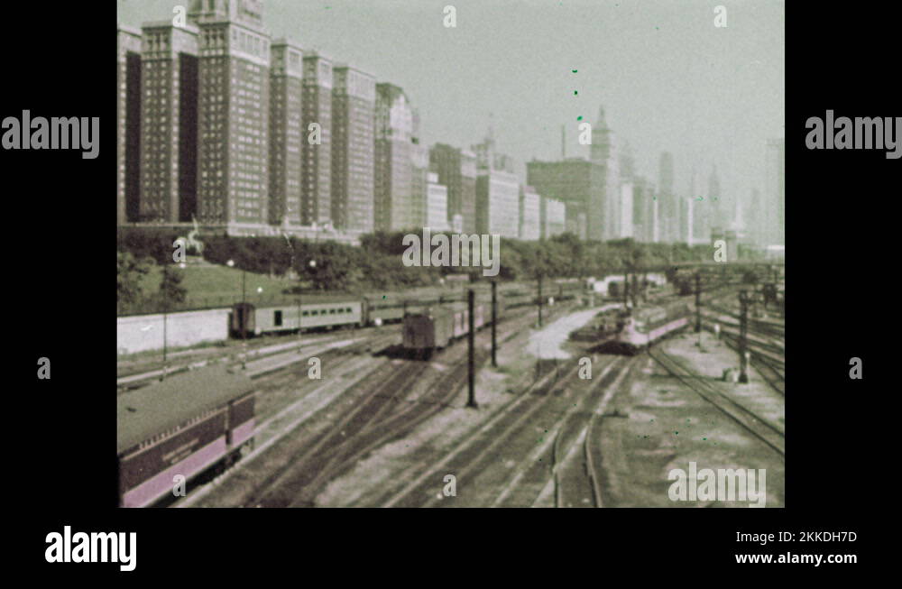 1950s: View of Chicago skyscrapers, rail yard. Map of United States ...
