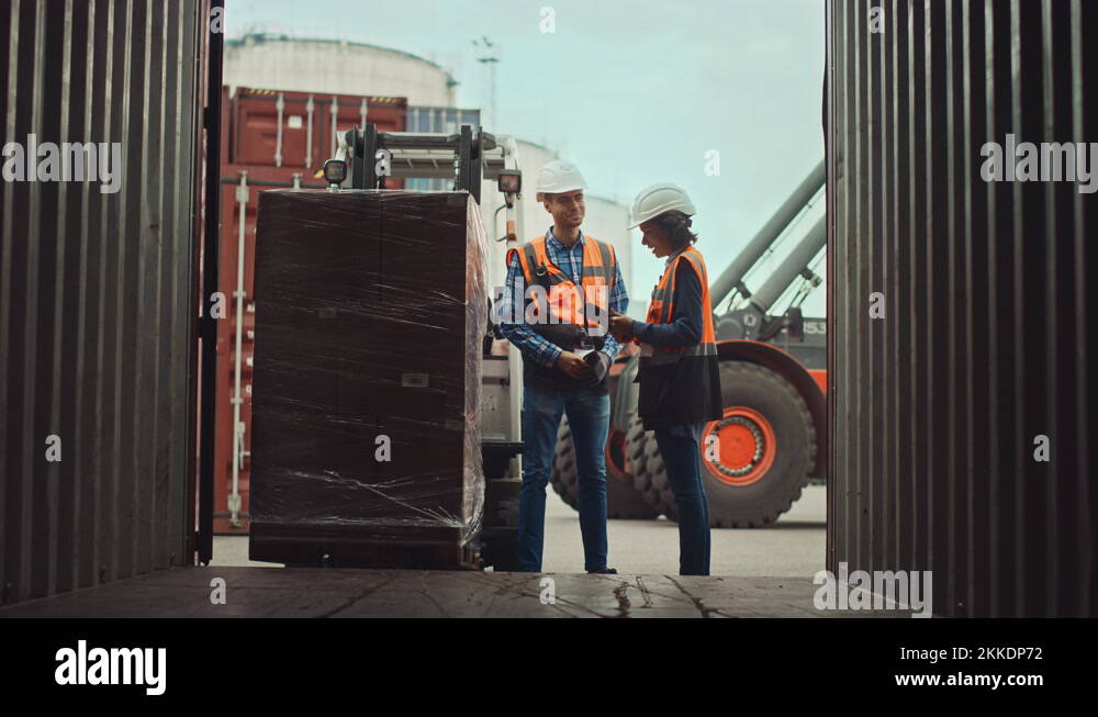 Worker and Forklift Driver Loading Container Stock Video Footage - Alamy