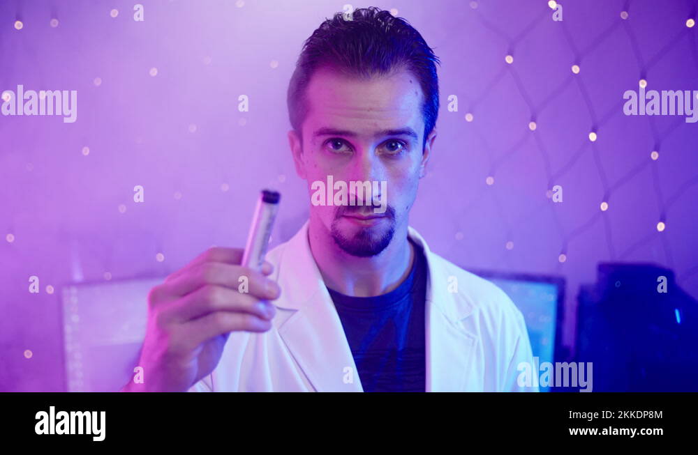 Mad Scientist scaring viewer with syringe 4K Stock Video Footage - Alamy