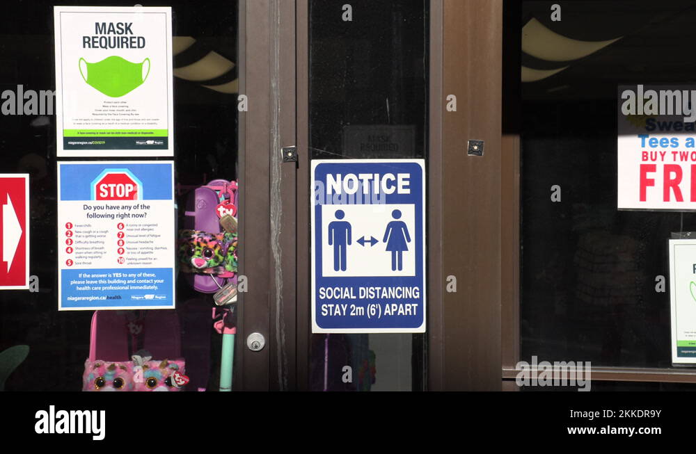 COVID 19 pandemic health safety signs on local businesses Stock Video ...