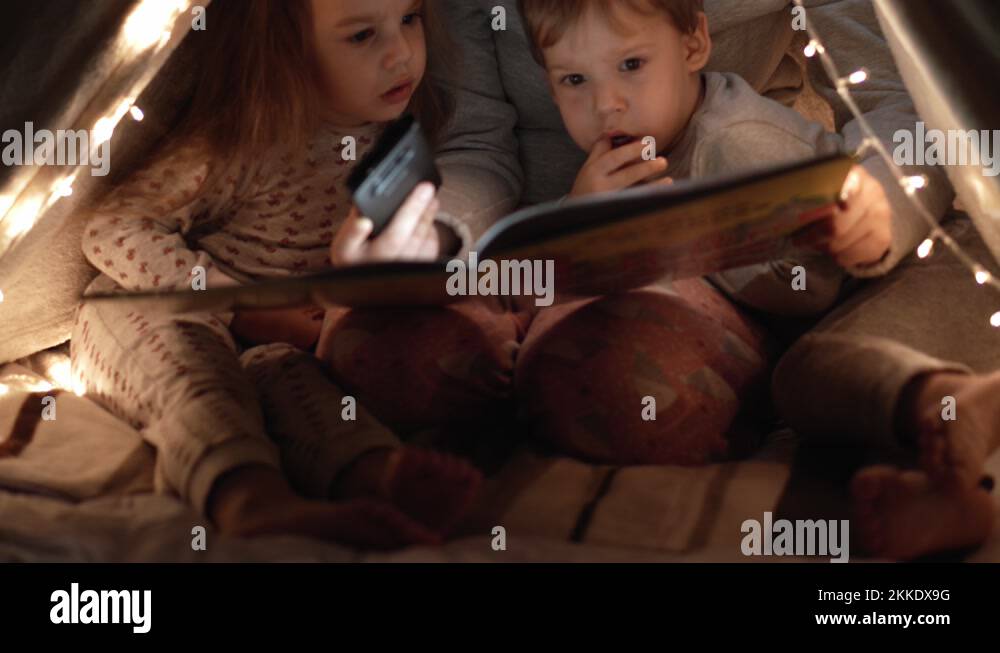 authentic tender cute mom and preschool kids boy and girl in tent at ...