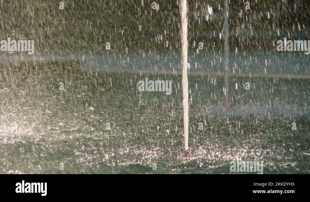 Water droplets texture created by fountain drops falling and splashing ...