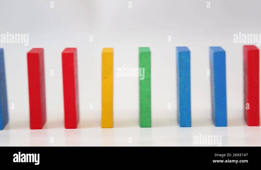 Colored wooden dominoes lined up in a row. Side view. Colorful wooden ...