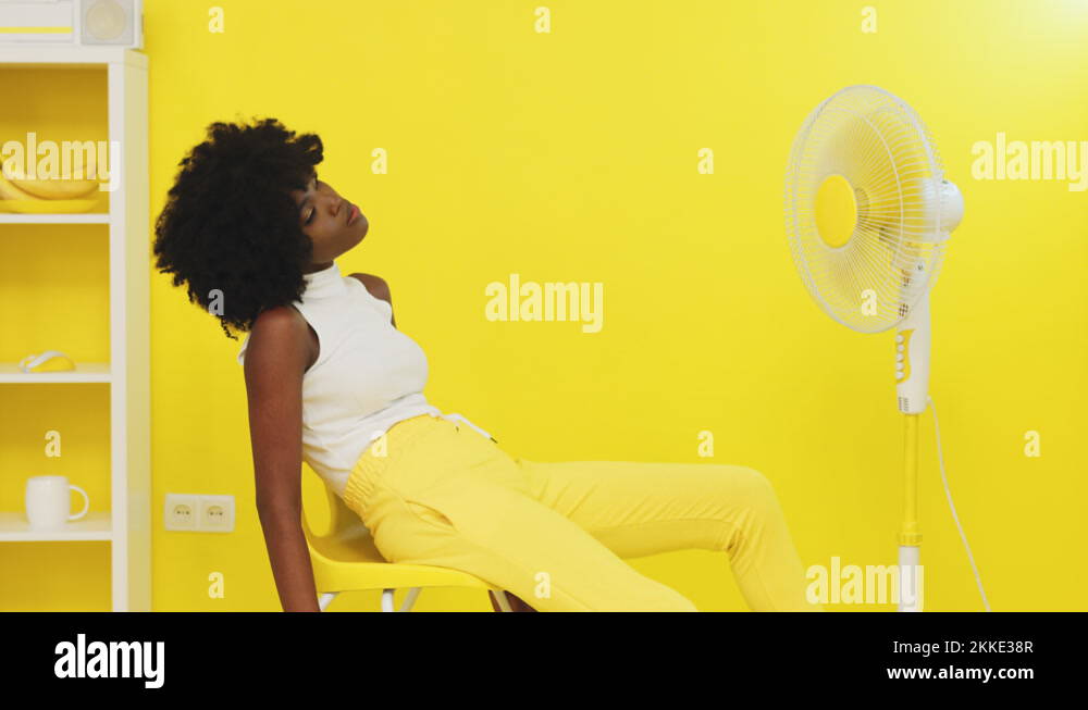 African Woman Is Sitting In Front of Fan Stock Video Footage - Alamy