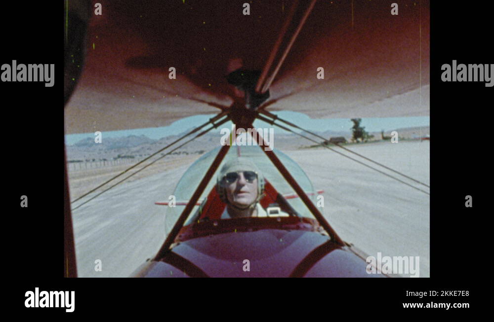 1970s: Cockpit of airplane with dials and gauges. Boy with eyes closed ...