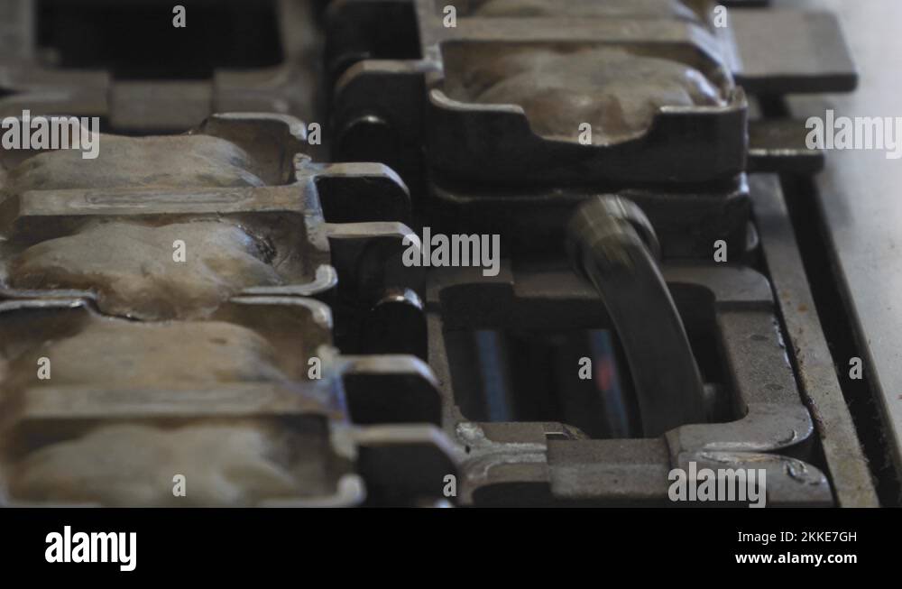 Tight Shot of Momiji Manju Machine Flipping Molds on Assembly Line Stock Video Footage - Alamy