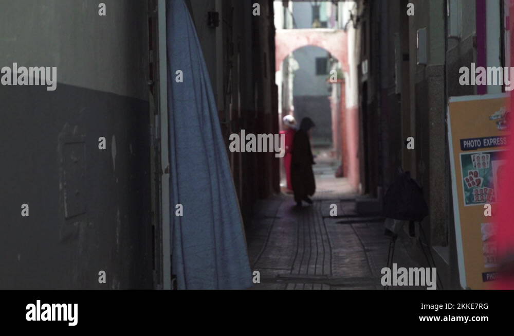 Man In Traditional Robe Walking In A Narrow Alley In Rabat, Morocco ...