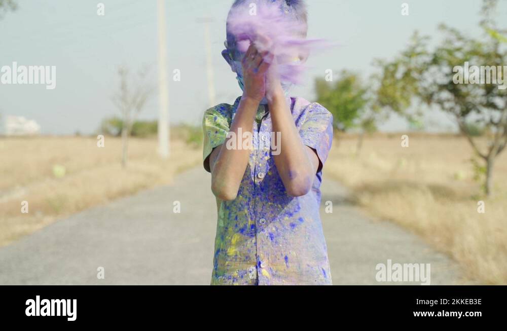 kid boy is clapping color in front of face with mask Stock Video ...