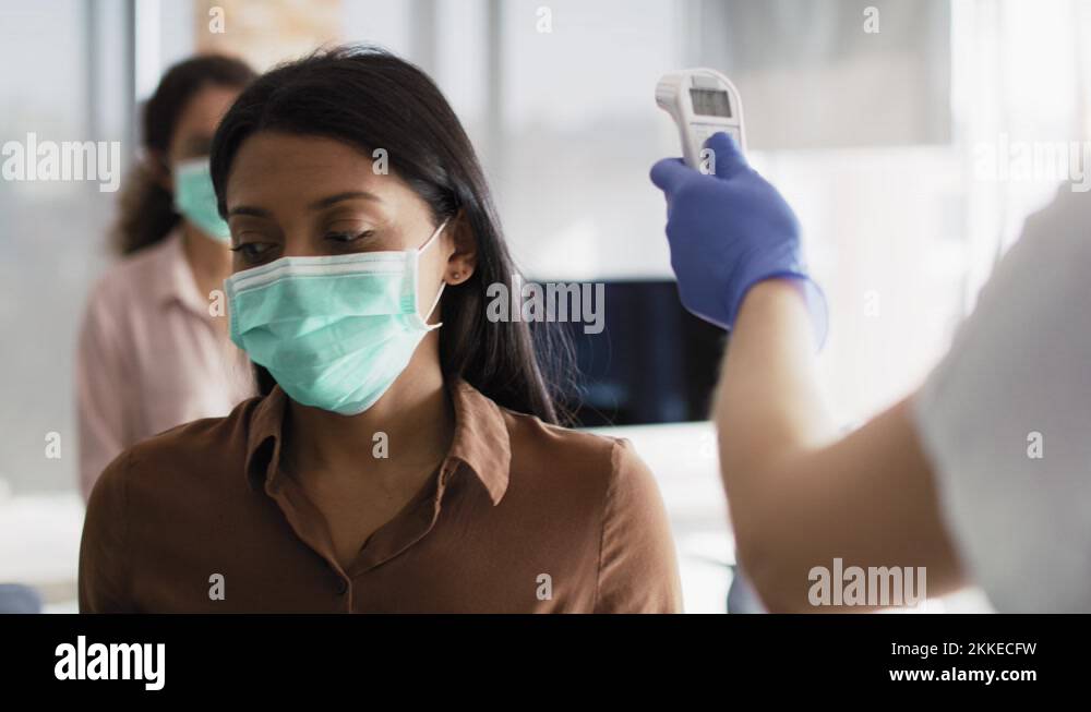 Video of employees going through mandatory temperature checks in office ...