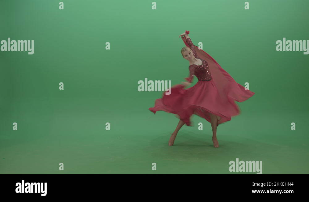 Spinning woman in red dress showing dance flamenco moves over green ...