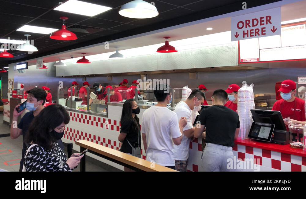 Singapore: Customers and staff inside Five Guys burger restaurant, 4K ...