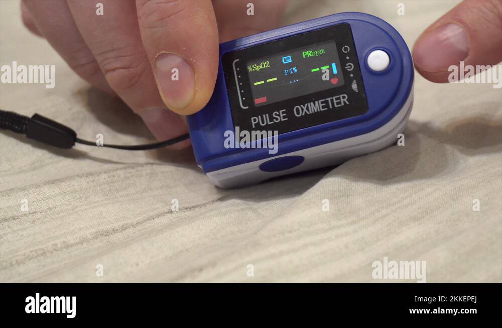 Health care concept. Pulse oximeter in a patient's finger. Measuring ...
