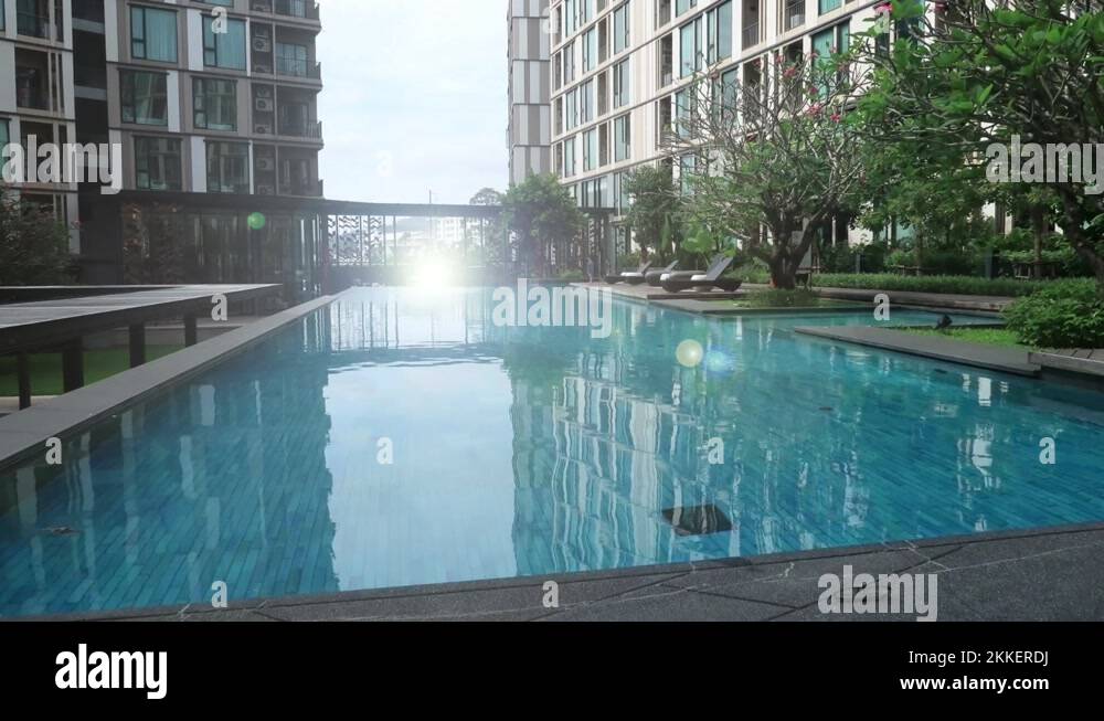 blue water pool with bright sun light ray n bokeh lens flare effect ...