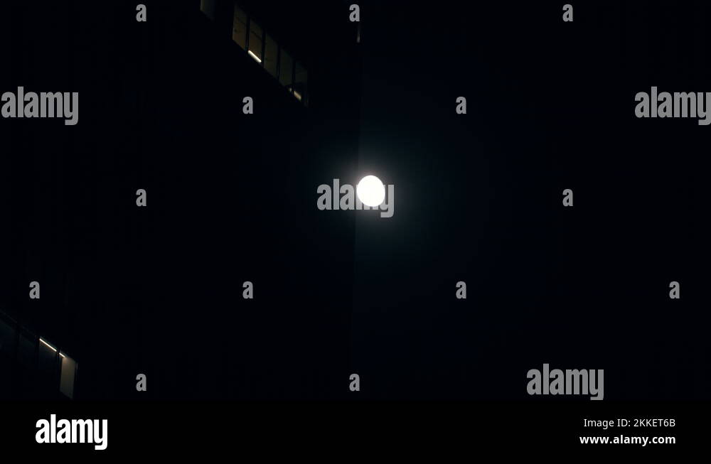 Waning Gibbous Moon Behind High-rise Building In The City At Night ...