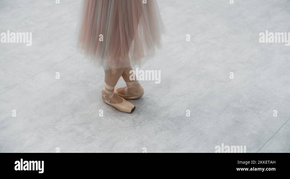 Ballerina dances on the ends of her pointe shoes, woman dance on her ...