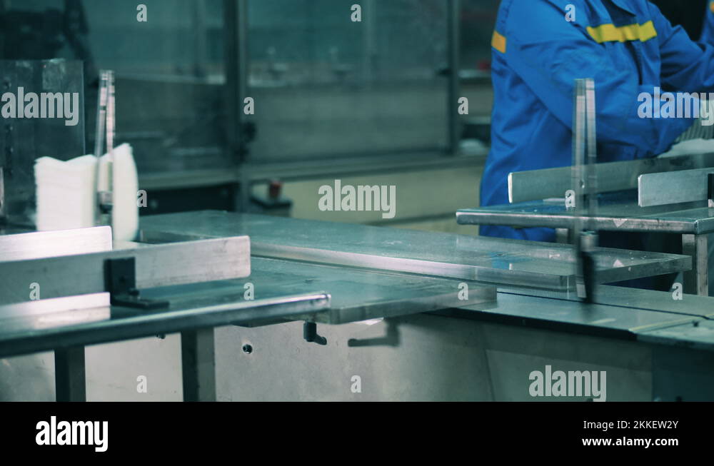 Female paper factory worker placing and sorting facial tissues Stock ...
