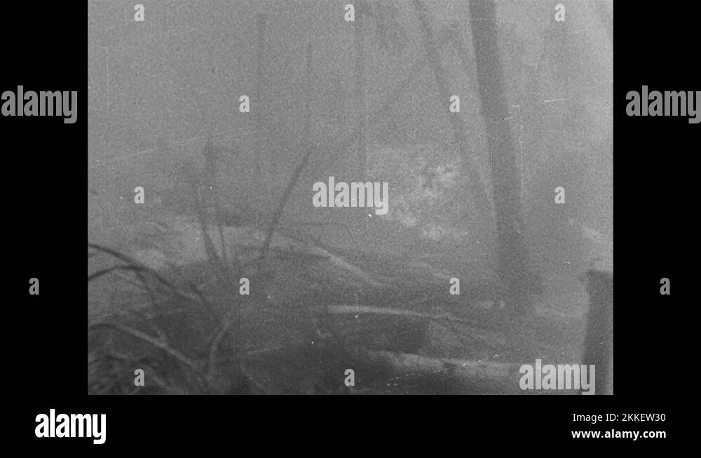 1940s: Soldiers run across beach in combat. Soldier fires gun. Soldiers ...