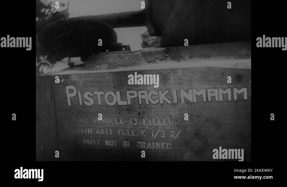 1940s: Wreckage of tank. Bullet holes. Names on tank read ...