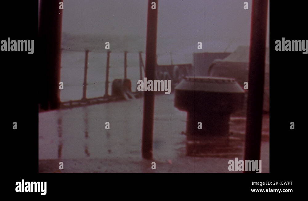 1940s: Ship travels quickly, rough waves crash over deck, whitecaps ...