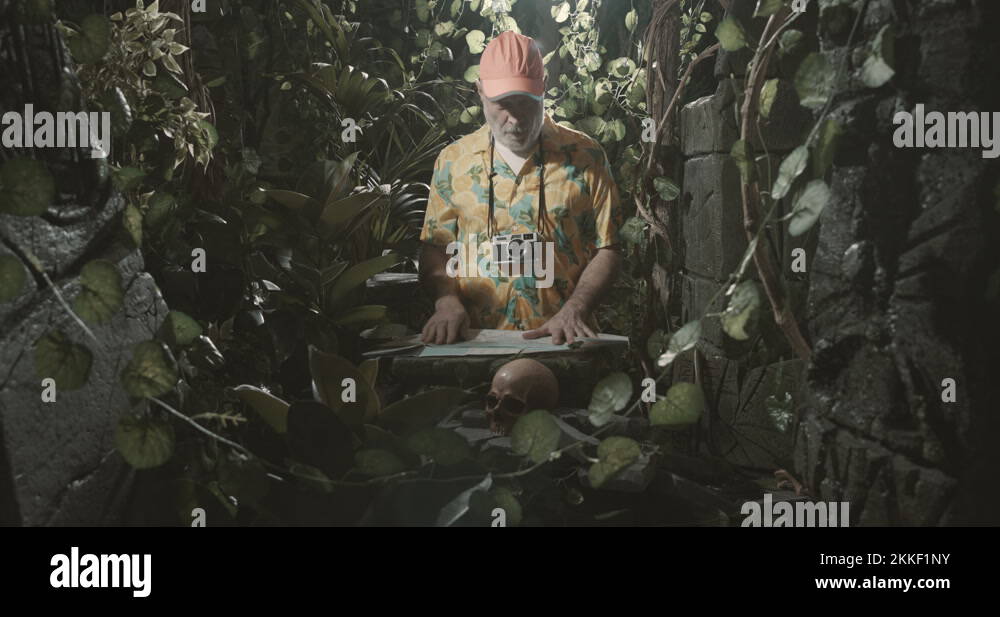 Scared tourist lost in the jungle with a map Stock Video Footage - Alamy