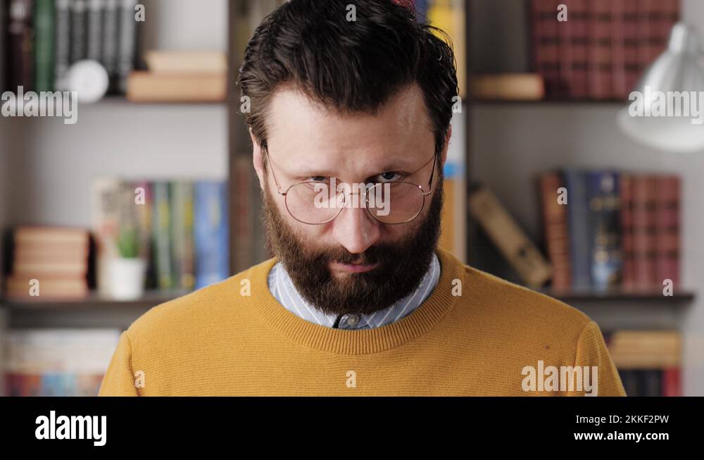 Man nods in agreement. Positive bearded man in glasses in office or ...