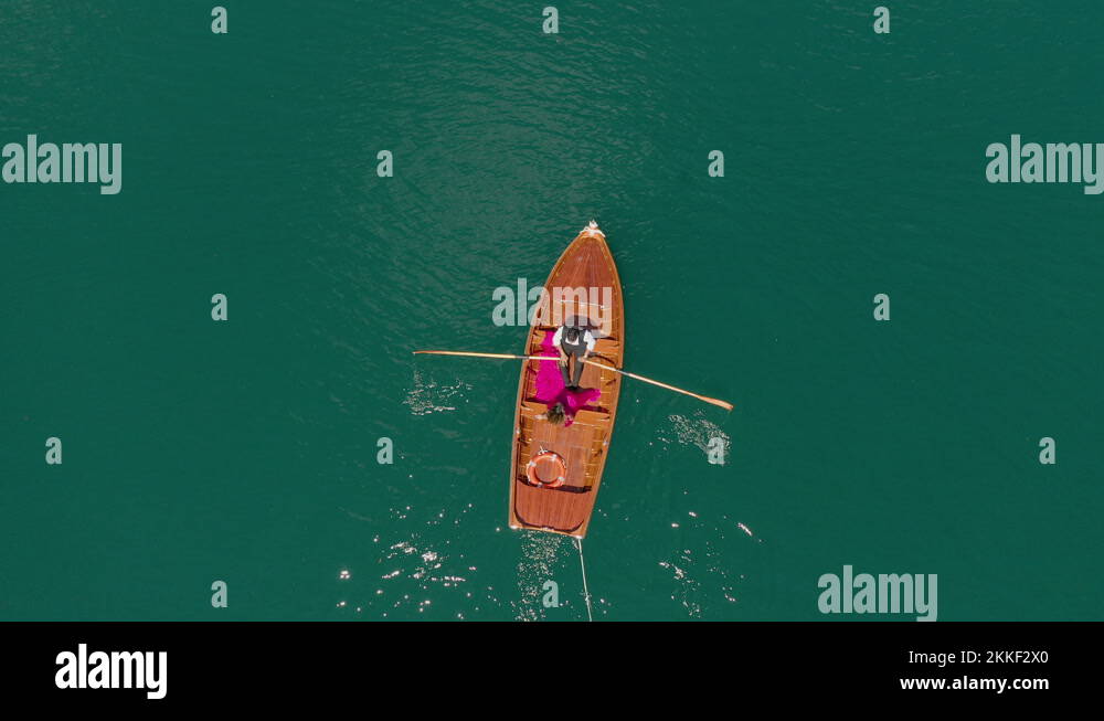 Drone Aerial Views Over A Rowing Boat With A Couple In Lago Di Braies ...