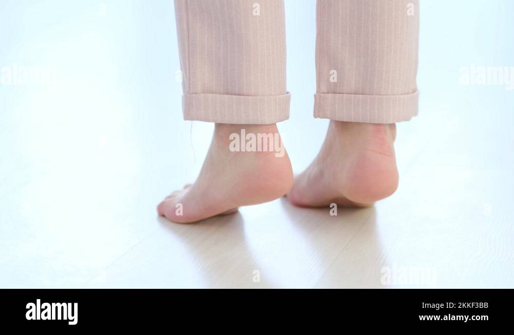 Side close up view of unrecognizable woman feet legs, barefoot girl ...