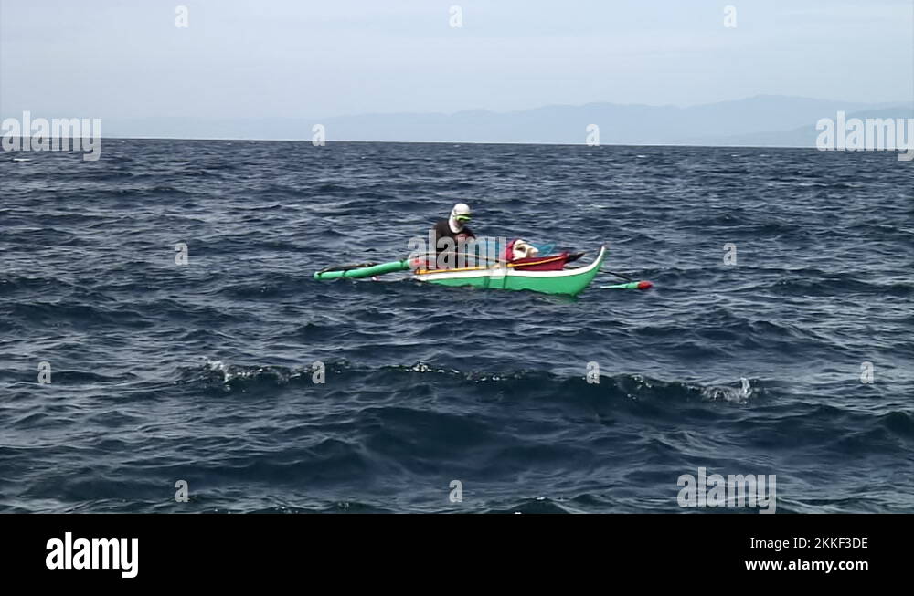 Philippine boat with bamboo wings on islands of Republic of Philippines ...