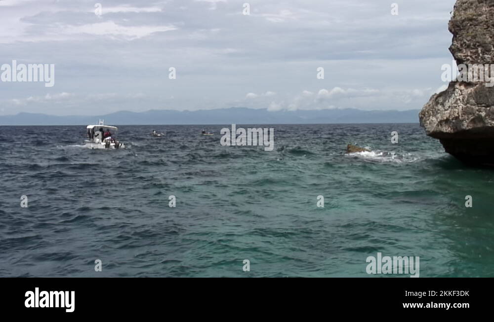 Philippine boat with bamboo wings on islands of Republic of Philippines ...