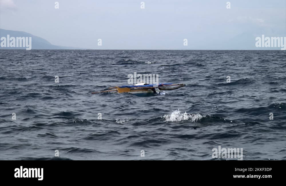 Philippine boat with bamboo wings on islands of Republic of Philippines ...